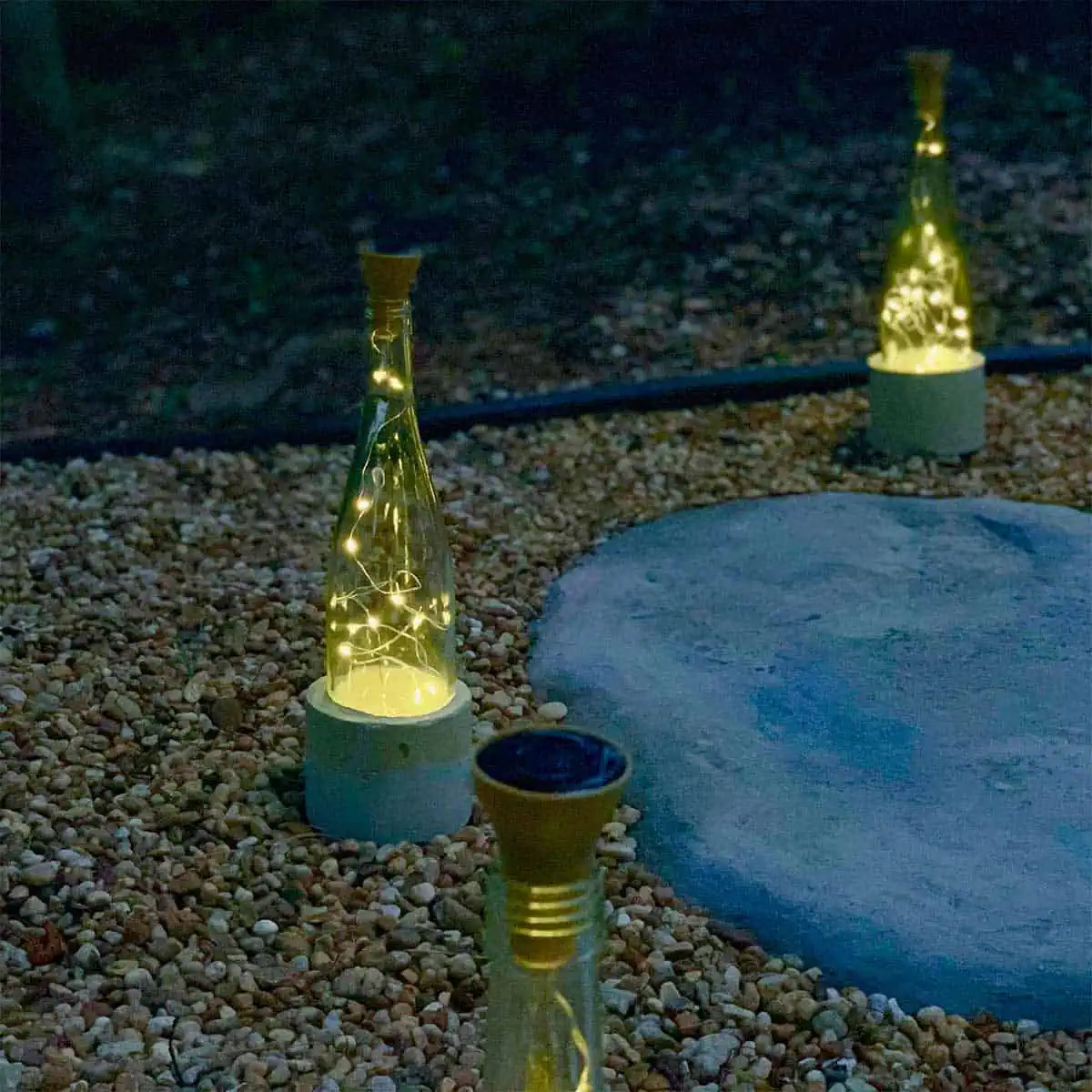 DIY Wine Bottle Lights with Pretty Cement Bases - Artsy Pretty Plants